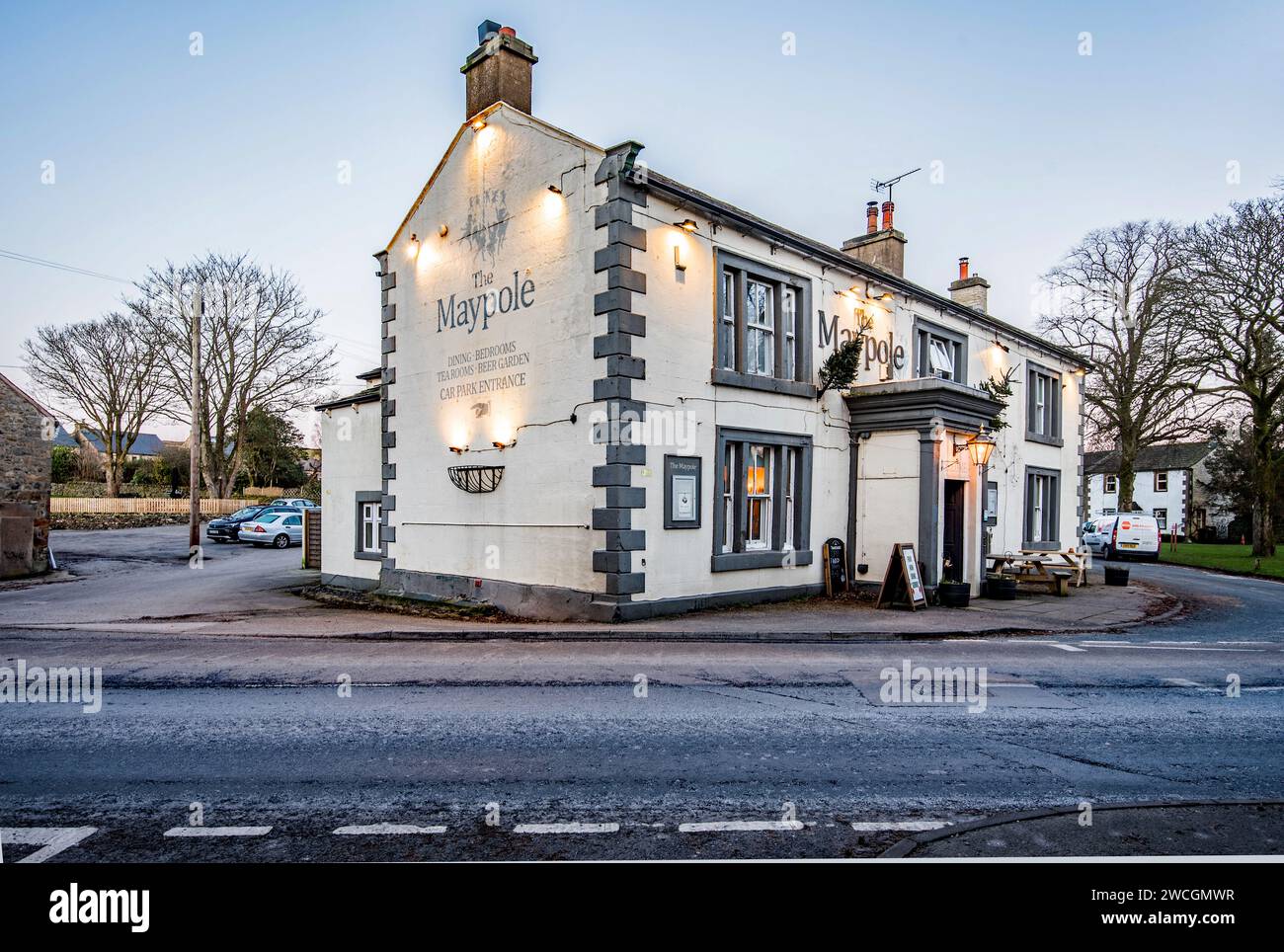 Lights come on as the sun has just gone down. This is The Maypole Inn ...