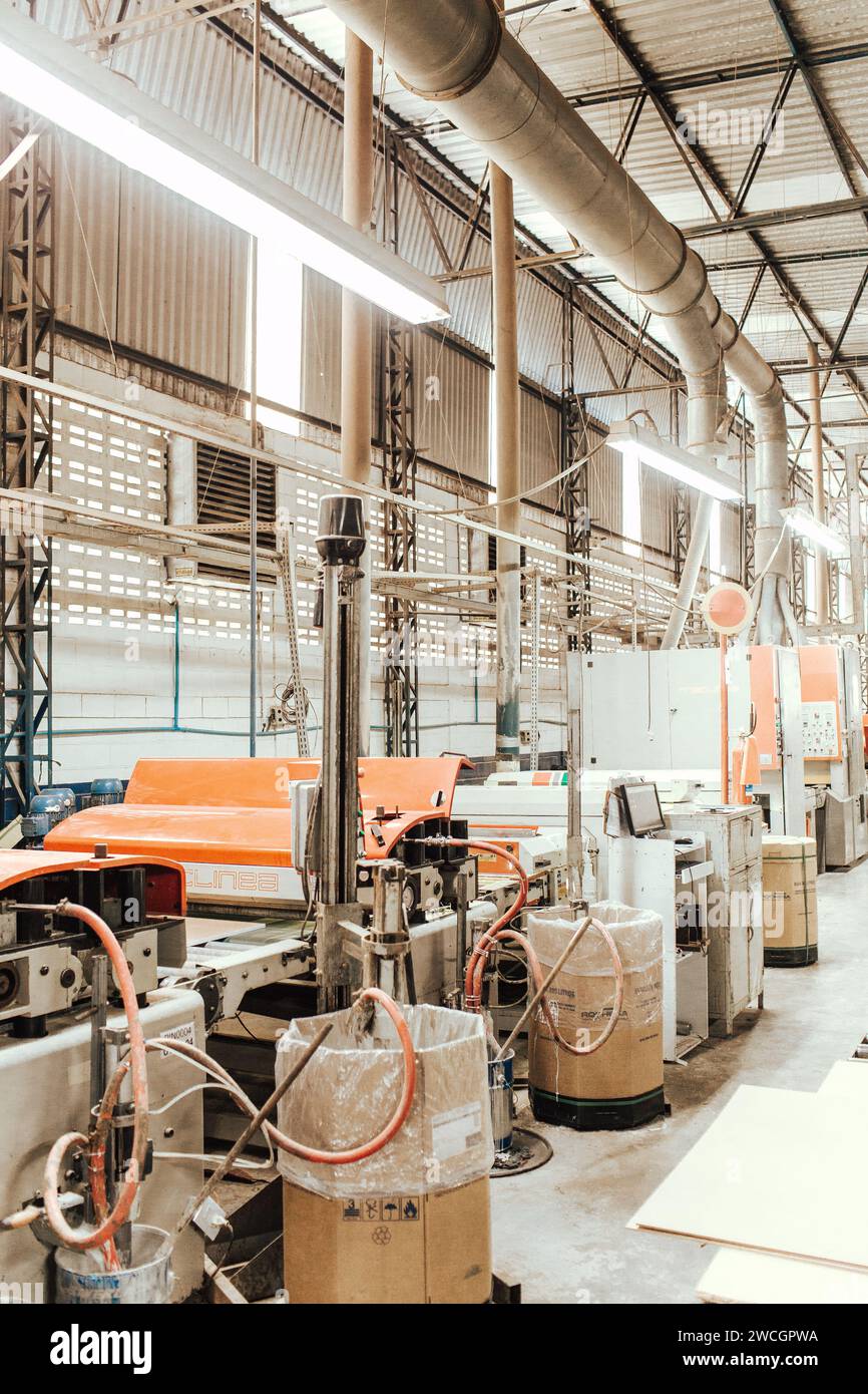 A vertical of an industrial machinery in a warehouse Stock Photo - Alamy