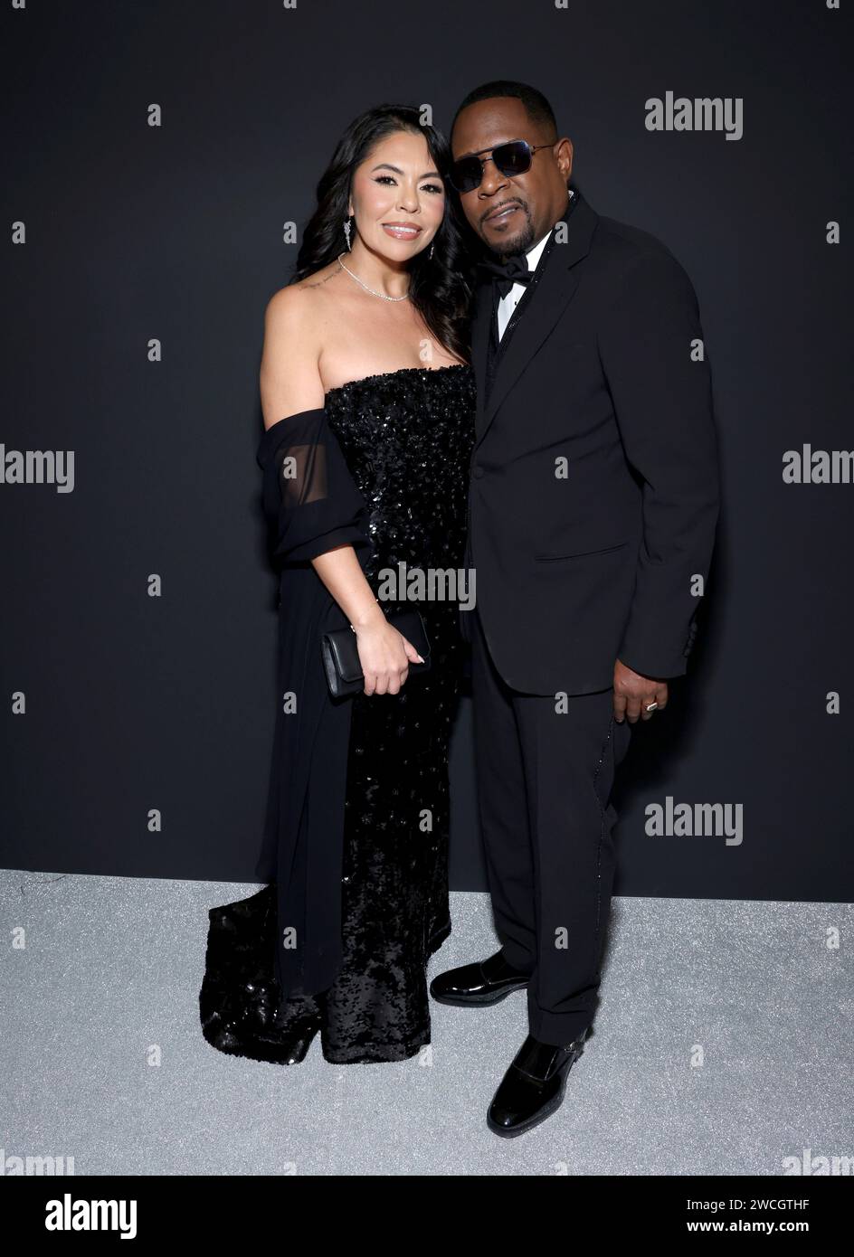 Angie Gonzales, left, and Martin Lawrence walk the red carpet at the ...