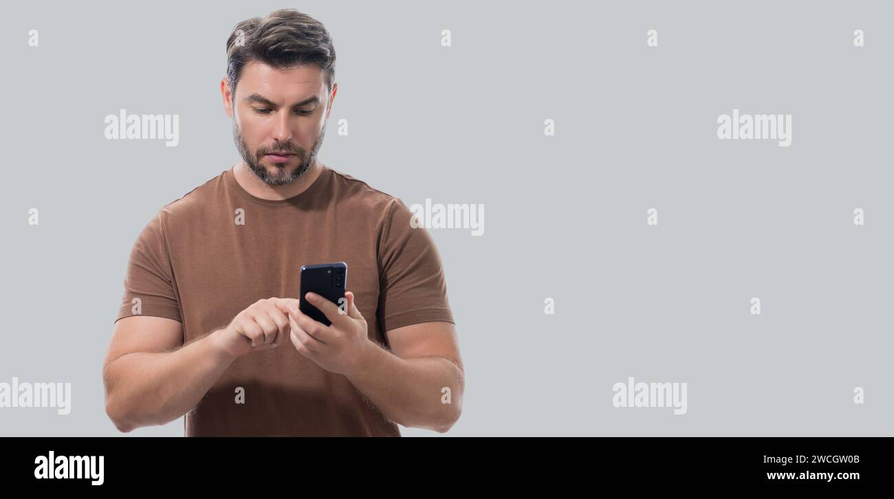 European business man watching on mobile phone. Handsome man wearing ...