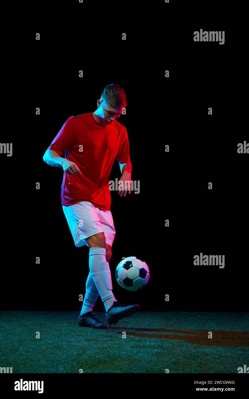 Striking Victory. Intense moment as soccer player unleashes powerful ...