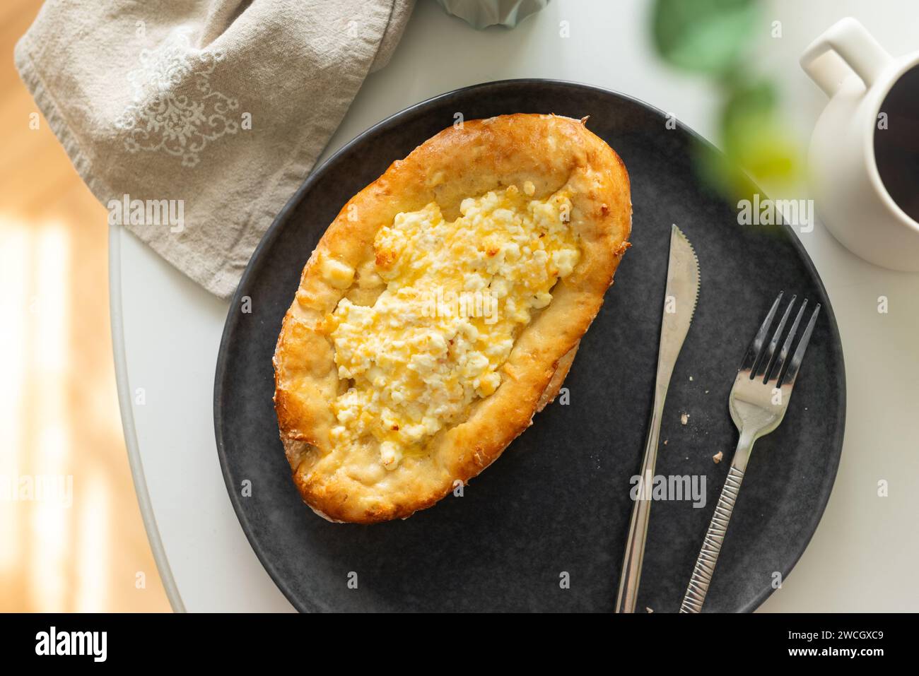 traditional Georgian cuisine. Open pie with mozzarella cheese. Ajara ...