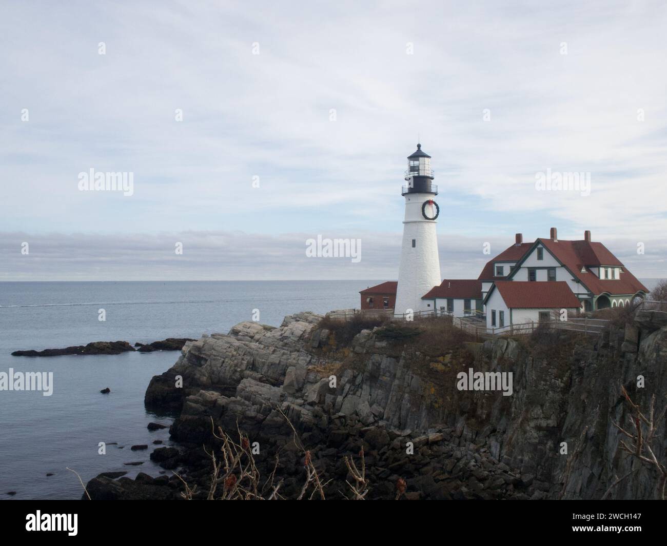 A lighthouse standing proudly on a rugged cliff, offering a magnificent ...