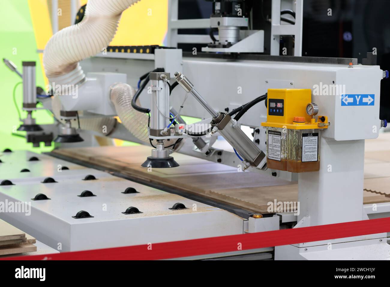 Automated CNC machine milling MDF kitchen cabinets doors. Selective ...