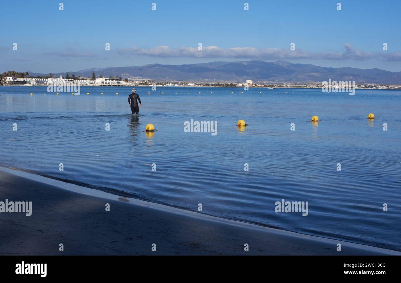 Swimmer poised to enter the water for a refreshing swim: the ...