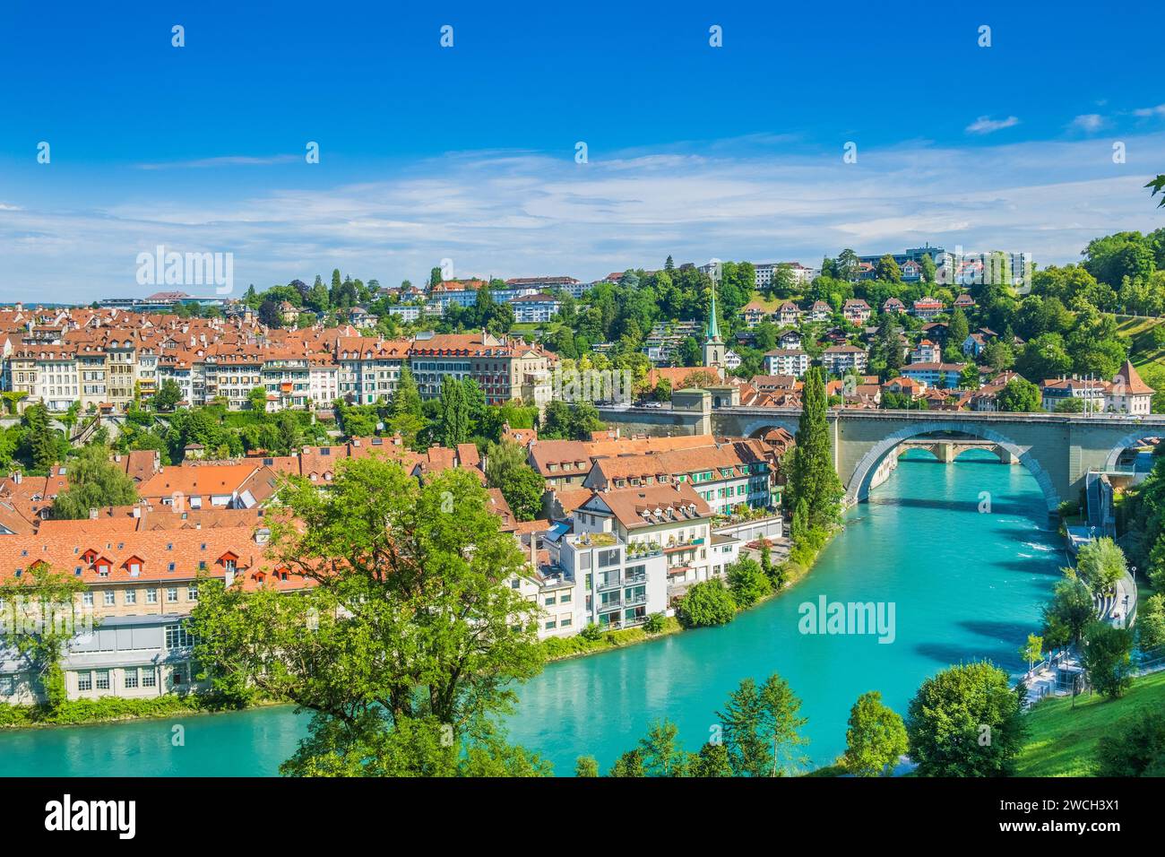 Panoramic view of Aare river, Nydeggbrucke bridge, cityscape of Bern ...