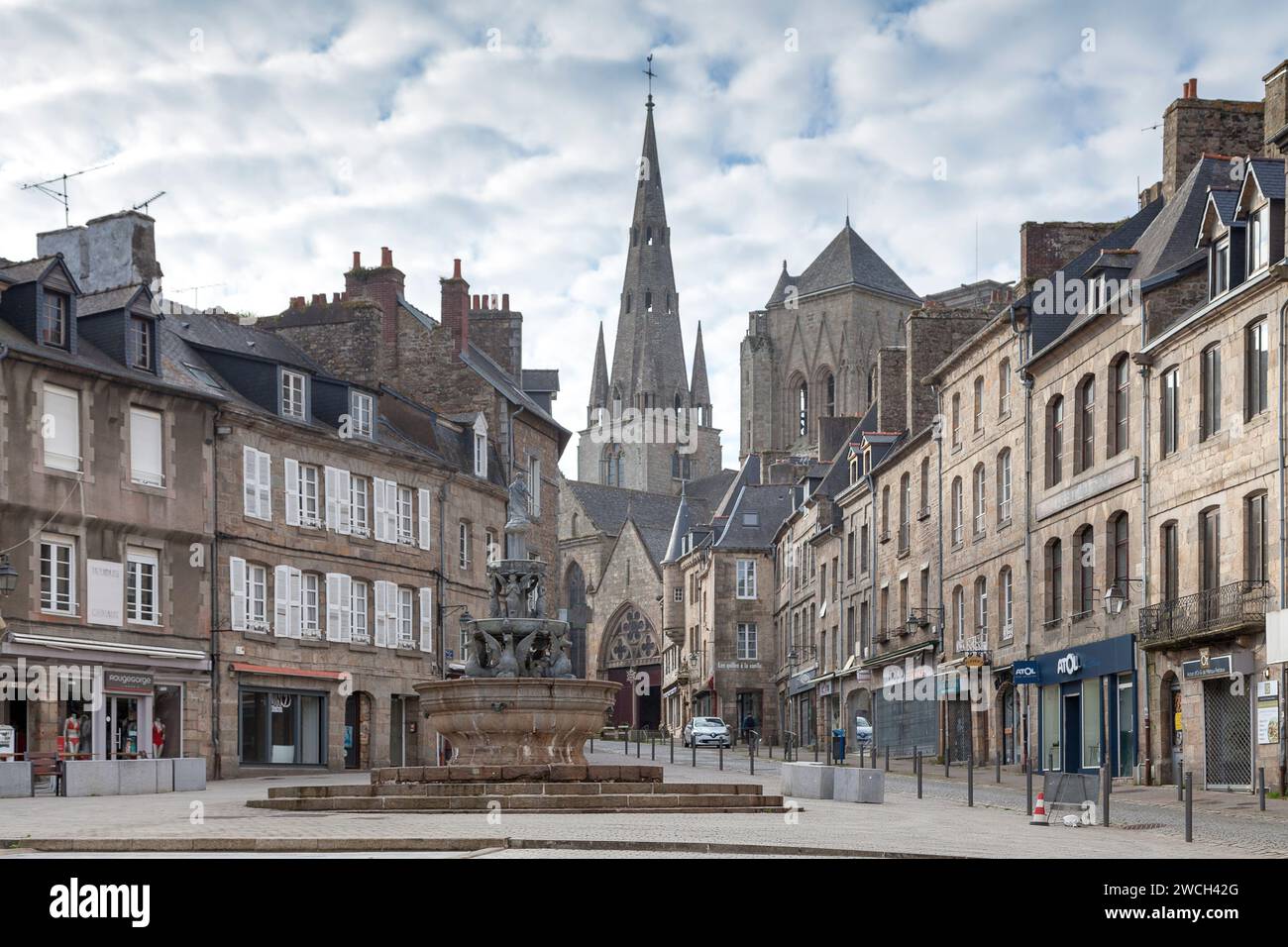 Guingamp, France - May 04 2022: The Plomée fountain with the Basilica ...