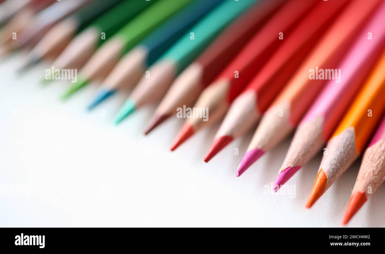 Many multicolored pencils lying on white background closeup Stock Photo ...