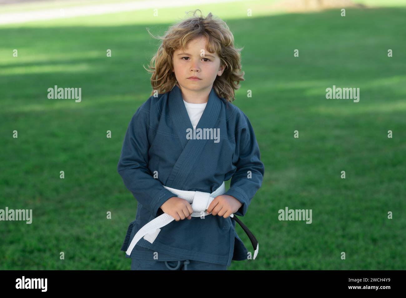 Kid boy practicing karate outdoor. Sport karate kids. Little boy ...