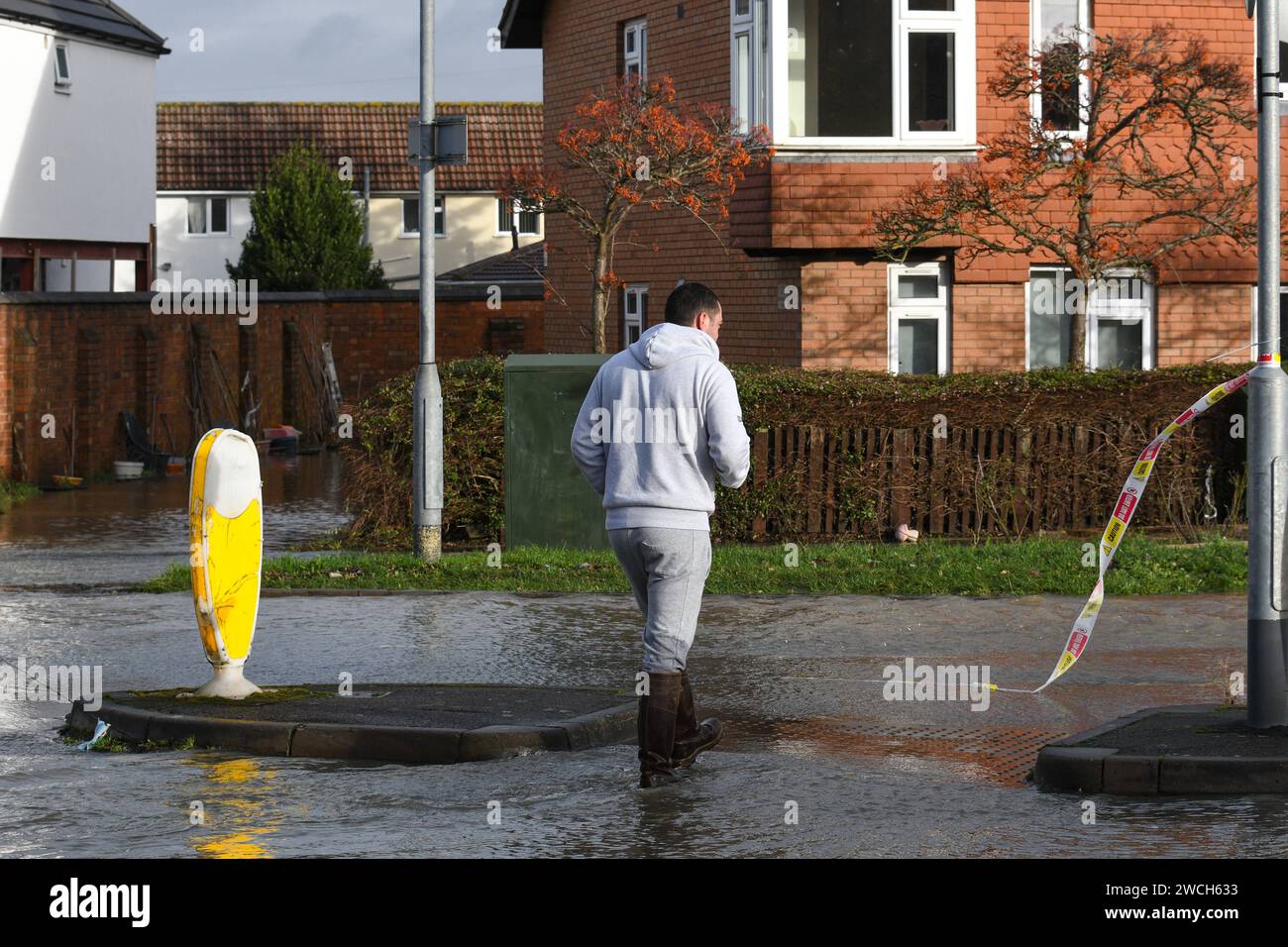 Man walking through floodwater hi-res stock photography and images - Alamy