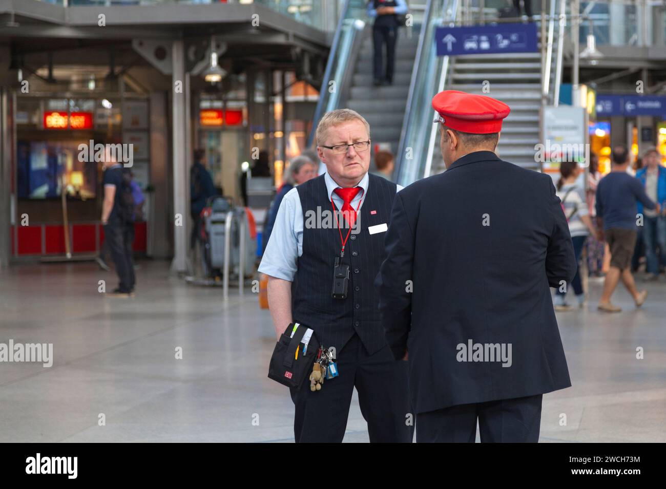 Munich, Germany - May 29 2019: Two employees of the DB bahn speaking at ...