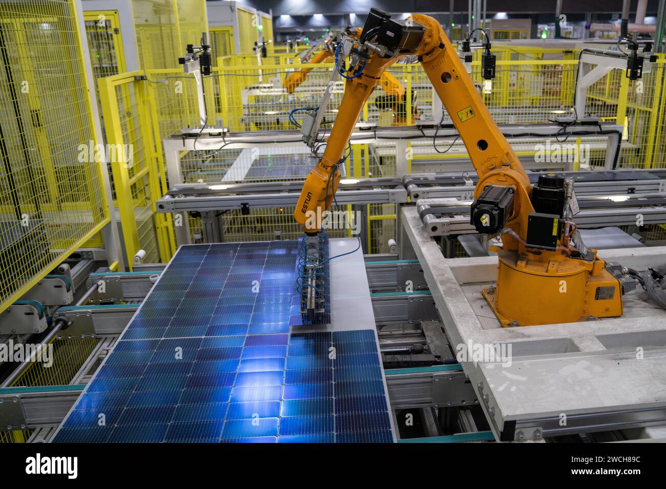 HEFEI, CHINA - JANUARY 16, 2024 - A robot places batteries in a ...