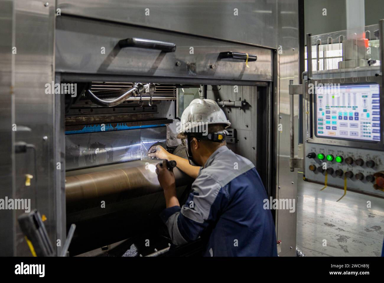 HEFEI, CHINA - JANUARY 16, 2024 - A worker works in front of a silicon ...