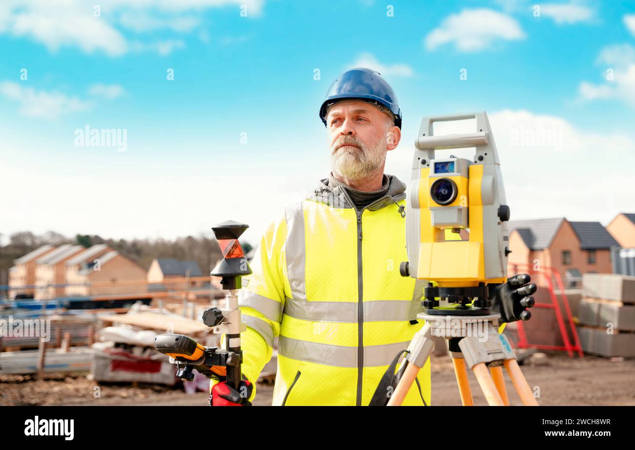 Surveyor builder site engineer with theodolite total station at ...