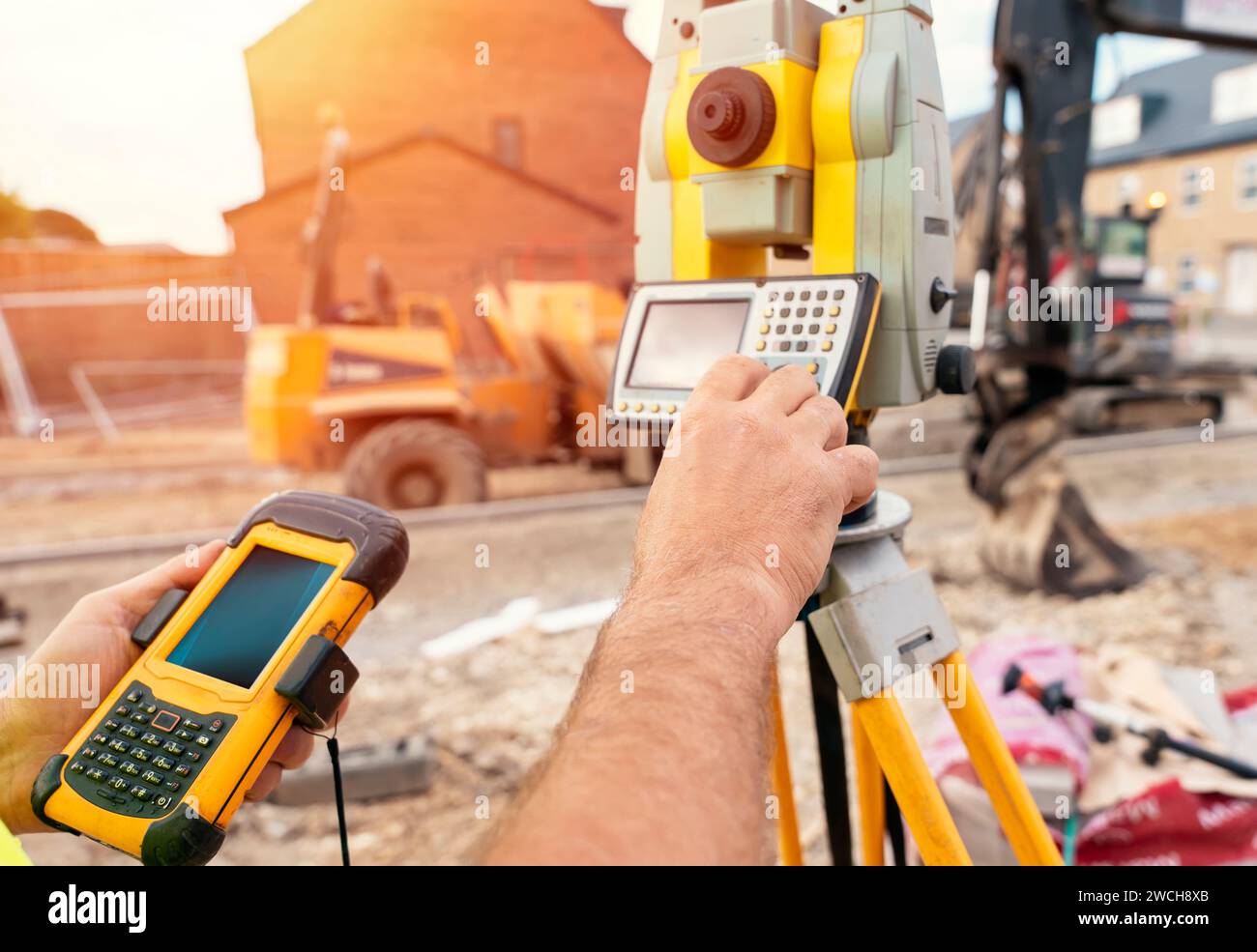 Surveyor operating theodolite total station hi-res stock photography ...