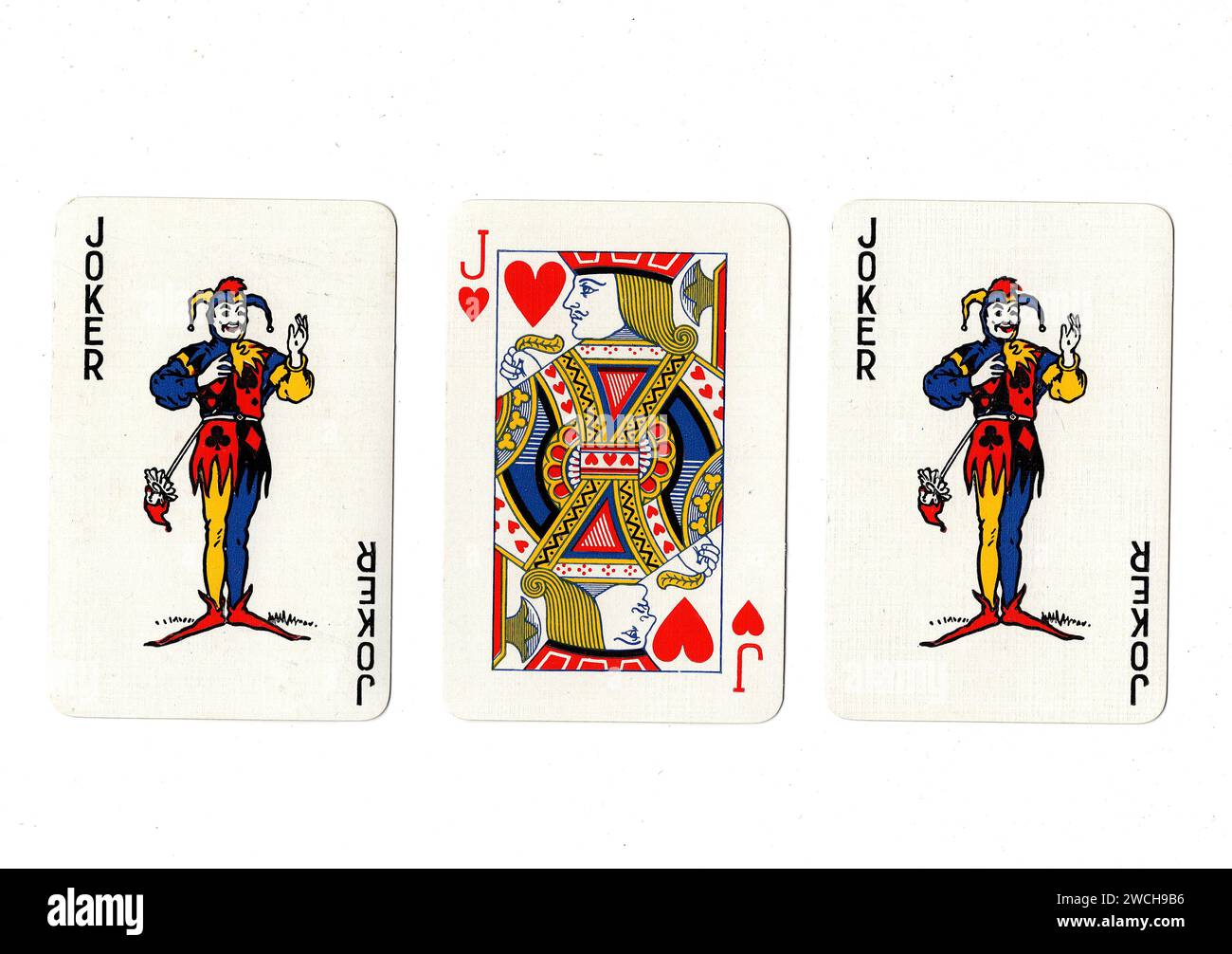 Vintage playing cards showing a pair of jokers and a red jack isolated ...