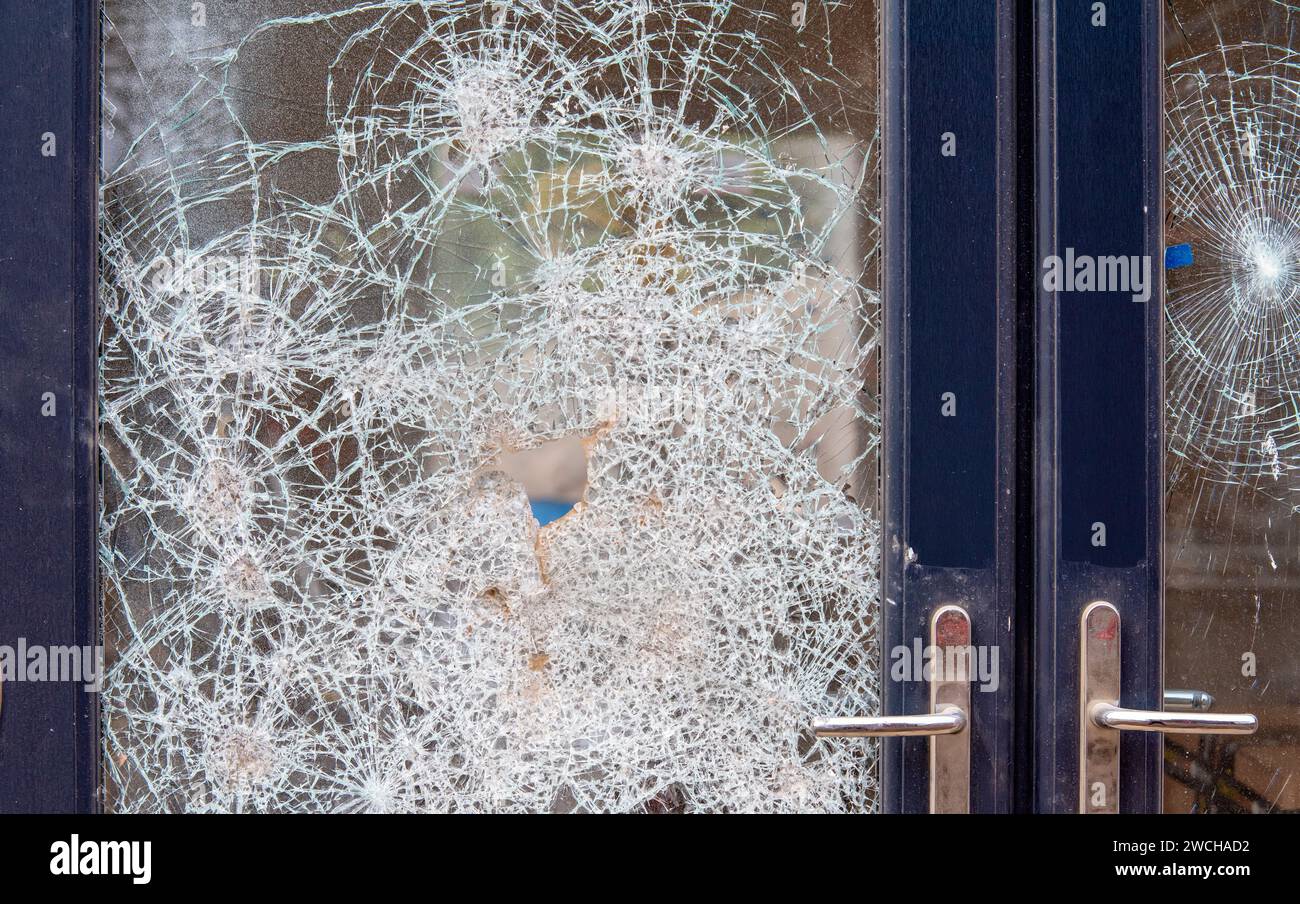 Broken window in new build house Stock Photo - Alamy