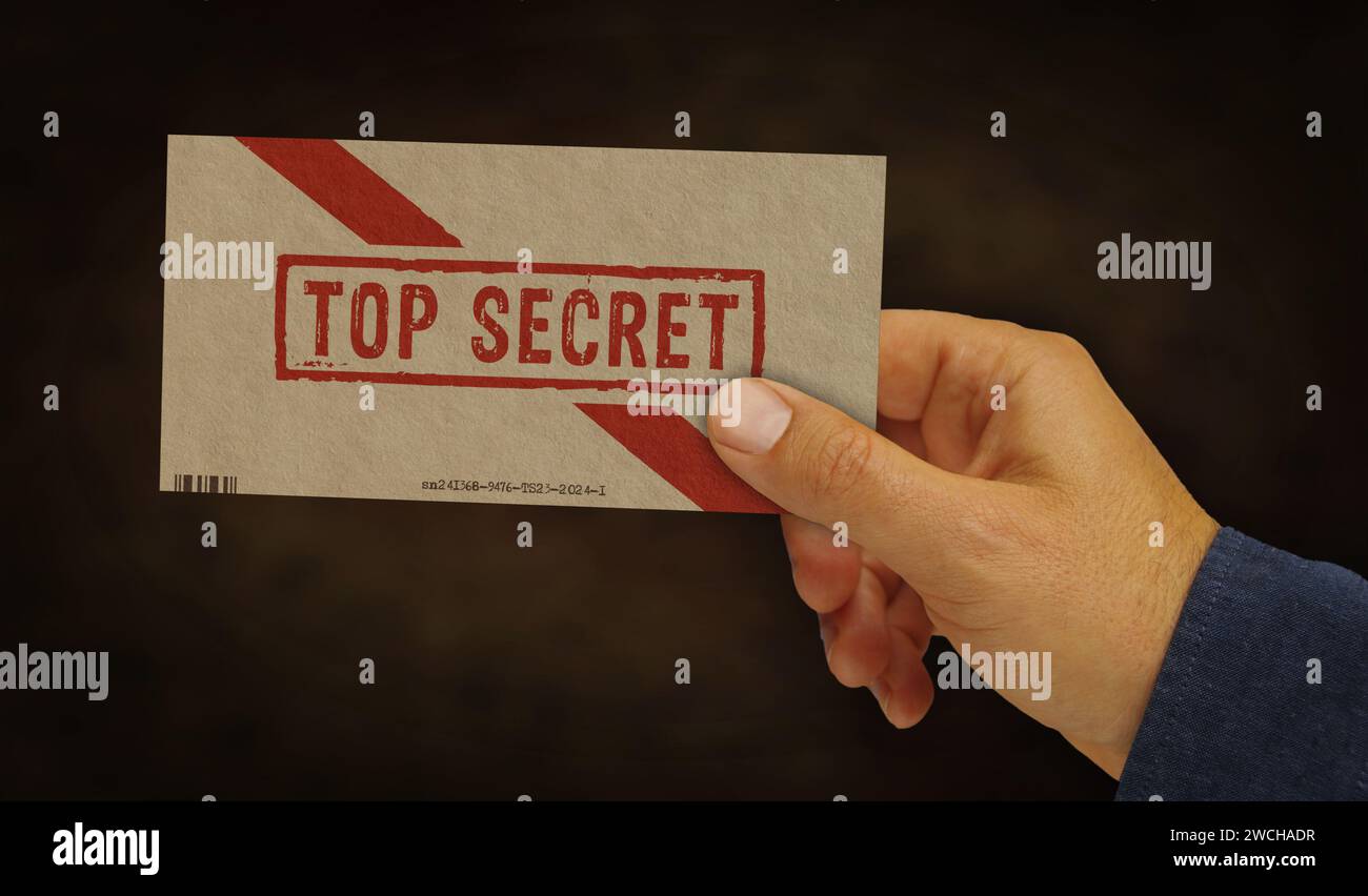 Top secret box in hand. Confidential documents cardboard pack factory ...