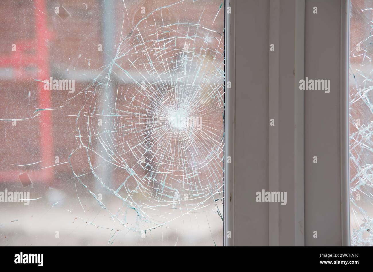 Broken window in new build house Stock Photo - Alamy