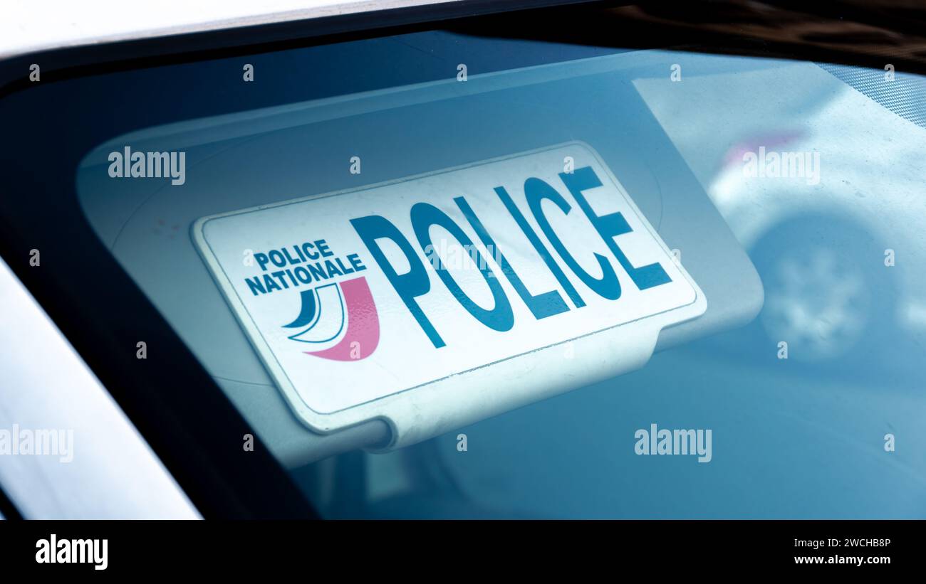 Close-up of the sun visor plate of an unmarked police vehicle with the ...
