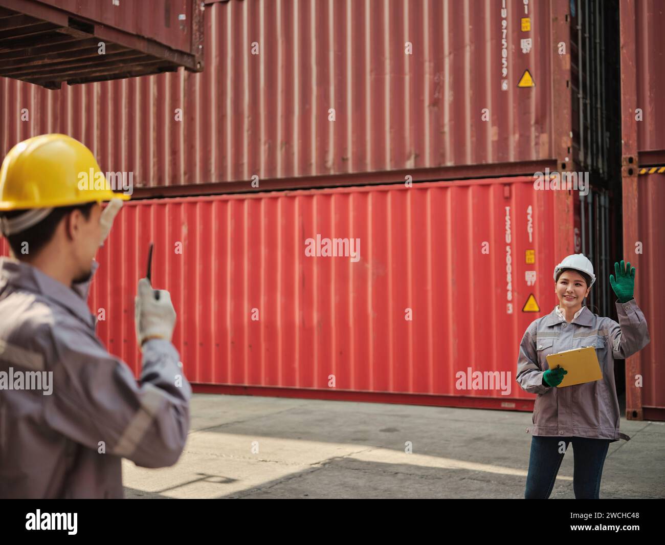 Team Engineer examining goods in Container cargo . Concept Teamwork ...