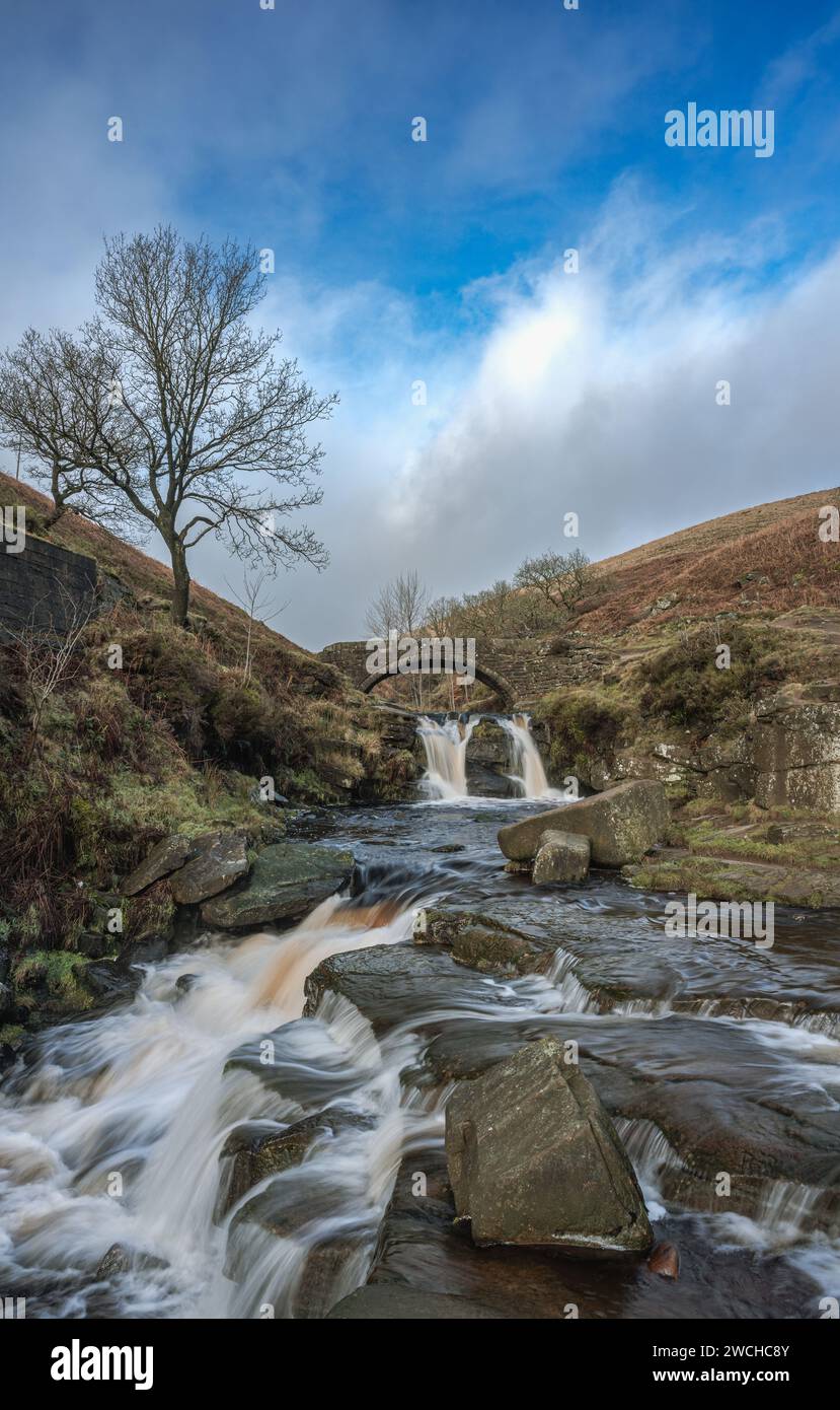 A rural winter landscape scene of the waterfall and packhorse stone ...