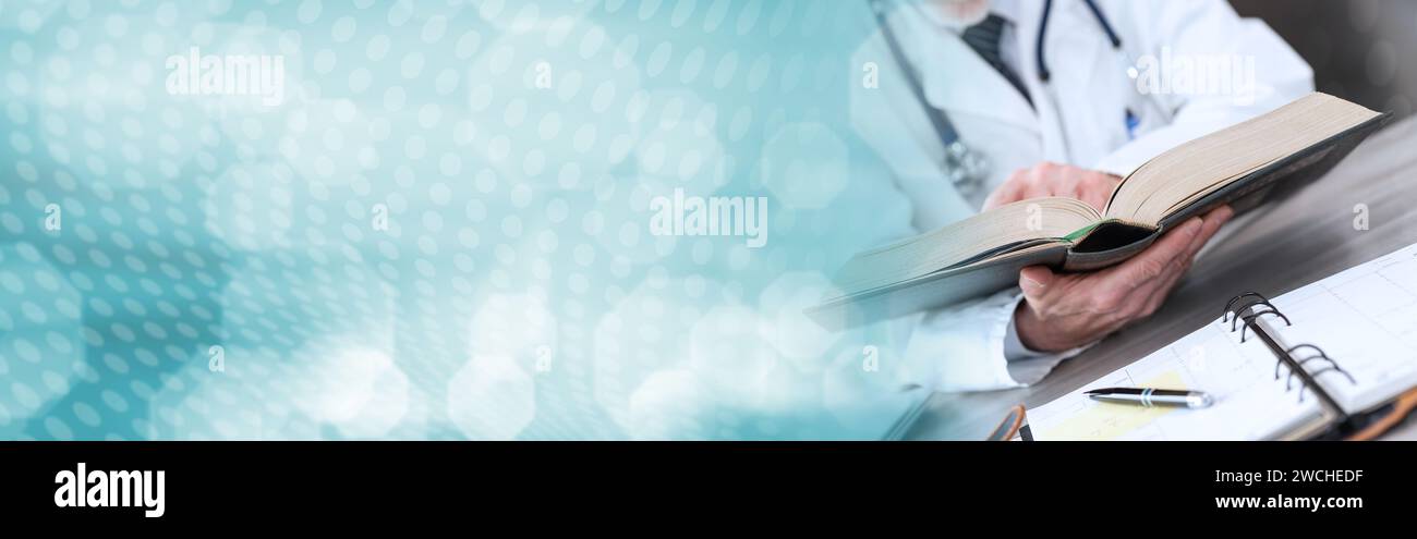 Doctor reading a textbook in medical office; panoramic banner Stock ...