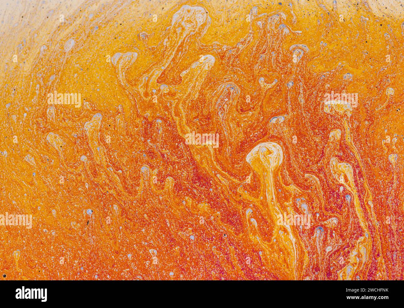 Colorful liquid mixture, blending paints in dynamic abstract fluid ...