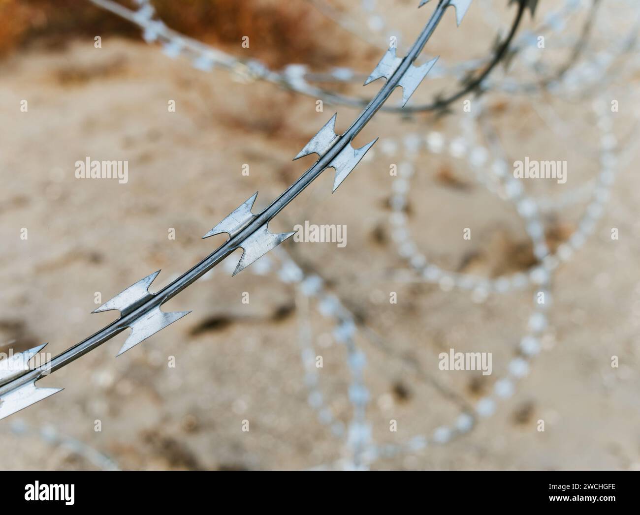 Barbed wire coil hi-res stock photography and images - Alamy