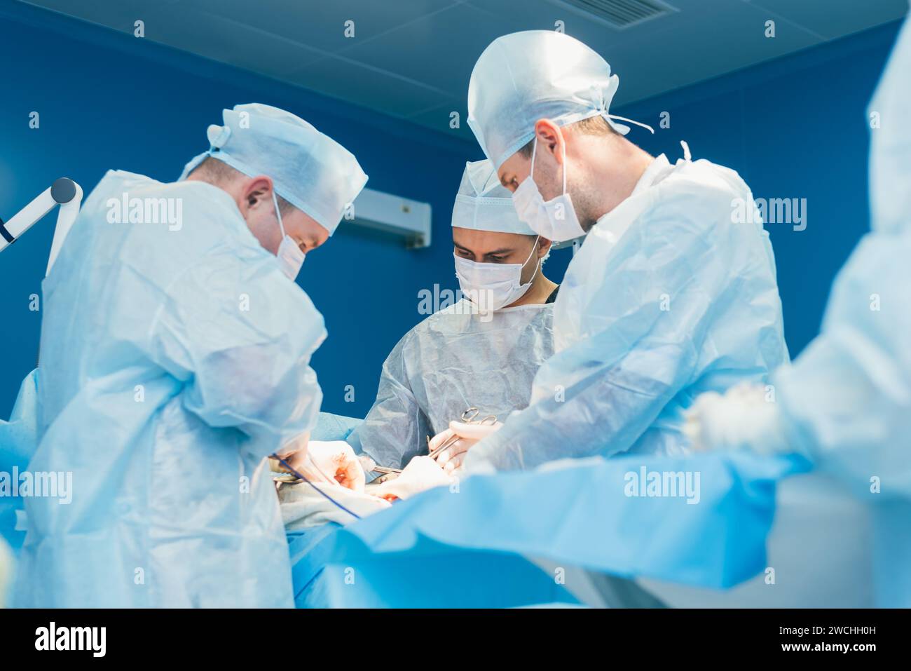 Team of professional surgeons doing surgery in hospital Stock Photo - Alamy
