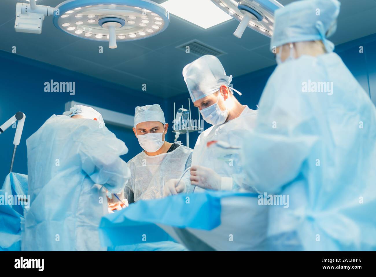 Surgical team doing operation patient hi-res stock photography and ...
