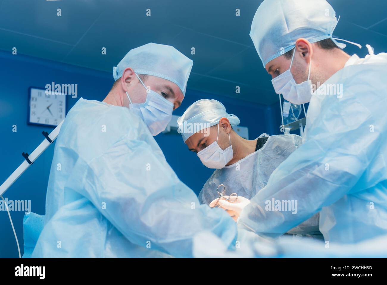 Surgical team doing operation patient hi-res stock photography and ...