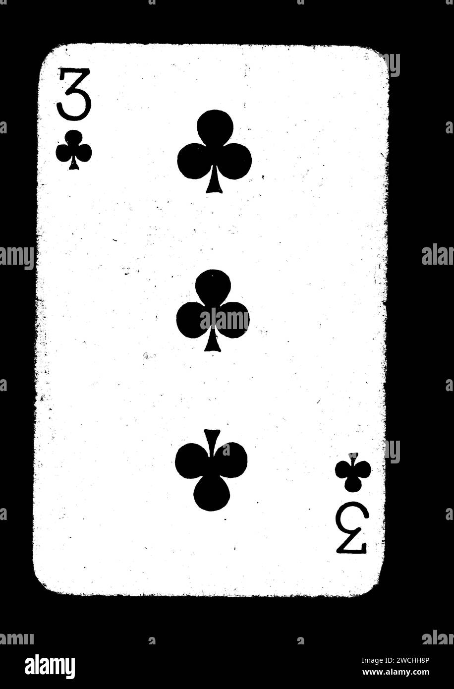 A vintage three of clubs playing card isolated on a black background ...