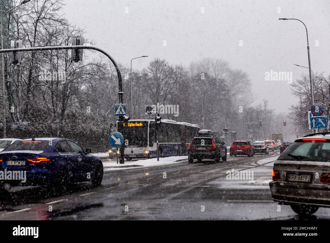 Krakow, Poland, January 16, 2024. Thick snow falls and driving ...