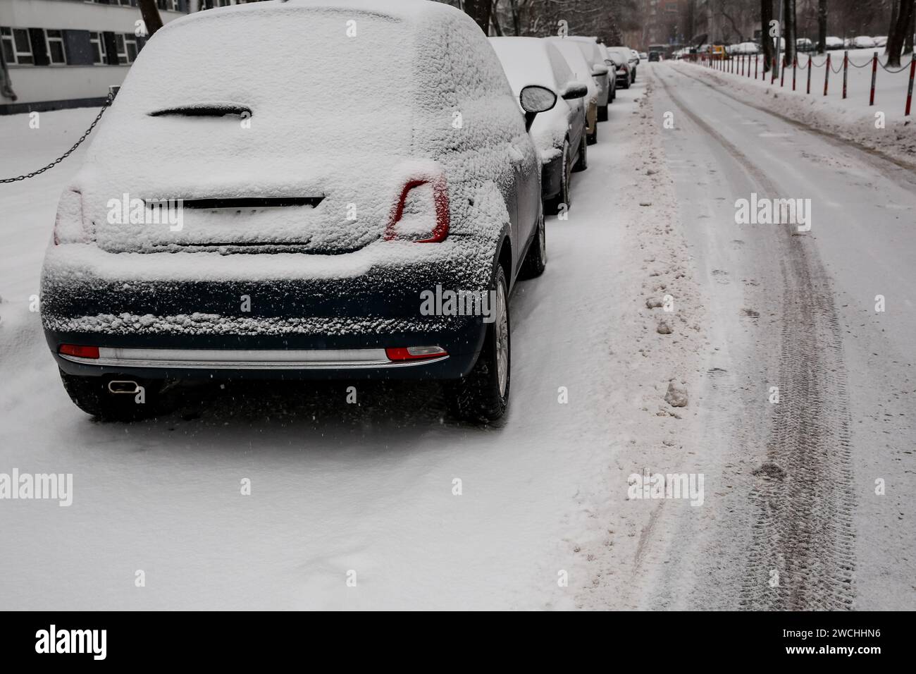 Krakow, Poland, January 16, 2024. Thick snow falls and driving ...