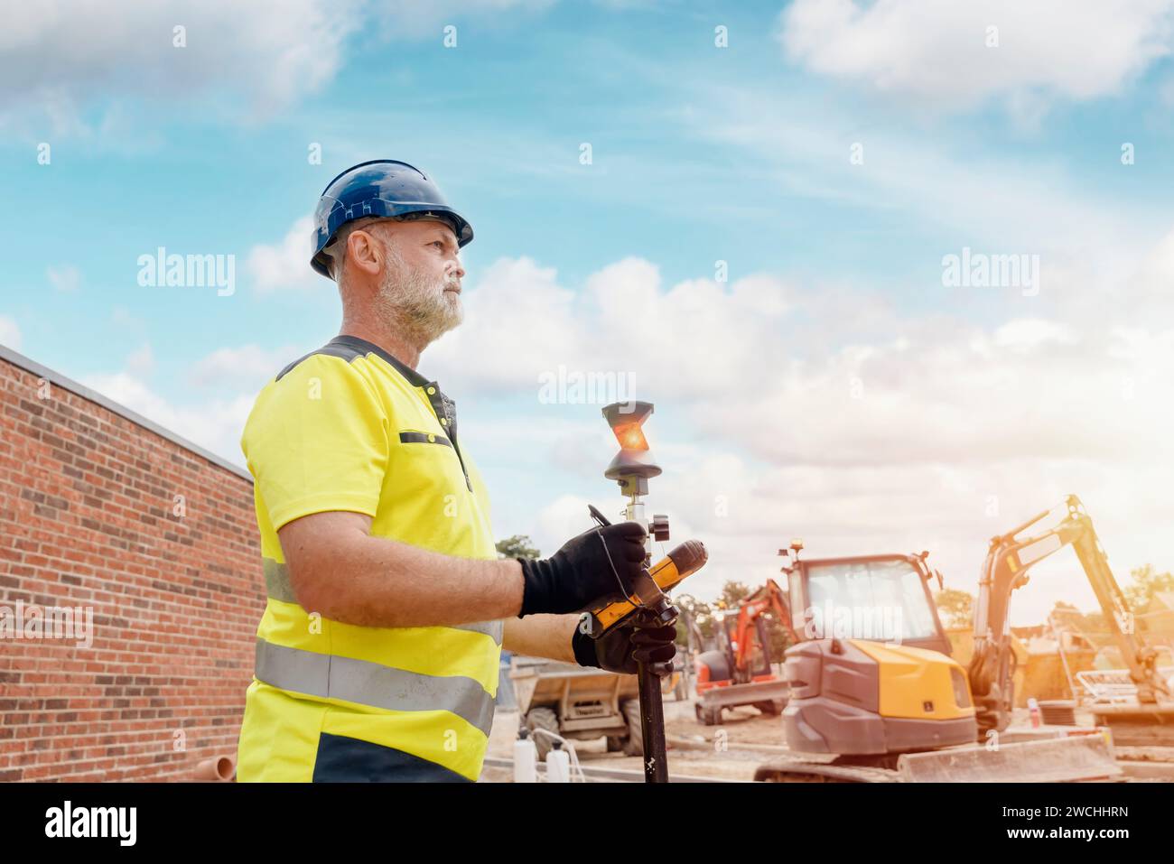 A man site engineer surveyor working with theodolite total station EDM ...