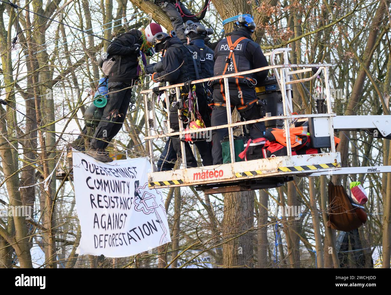 Hanover, Germany. 16th Jan, 2024. Police officers use a cherry picker ...