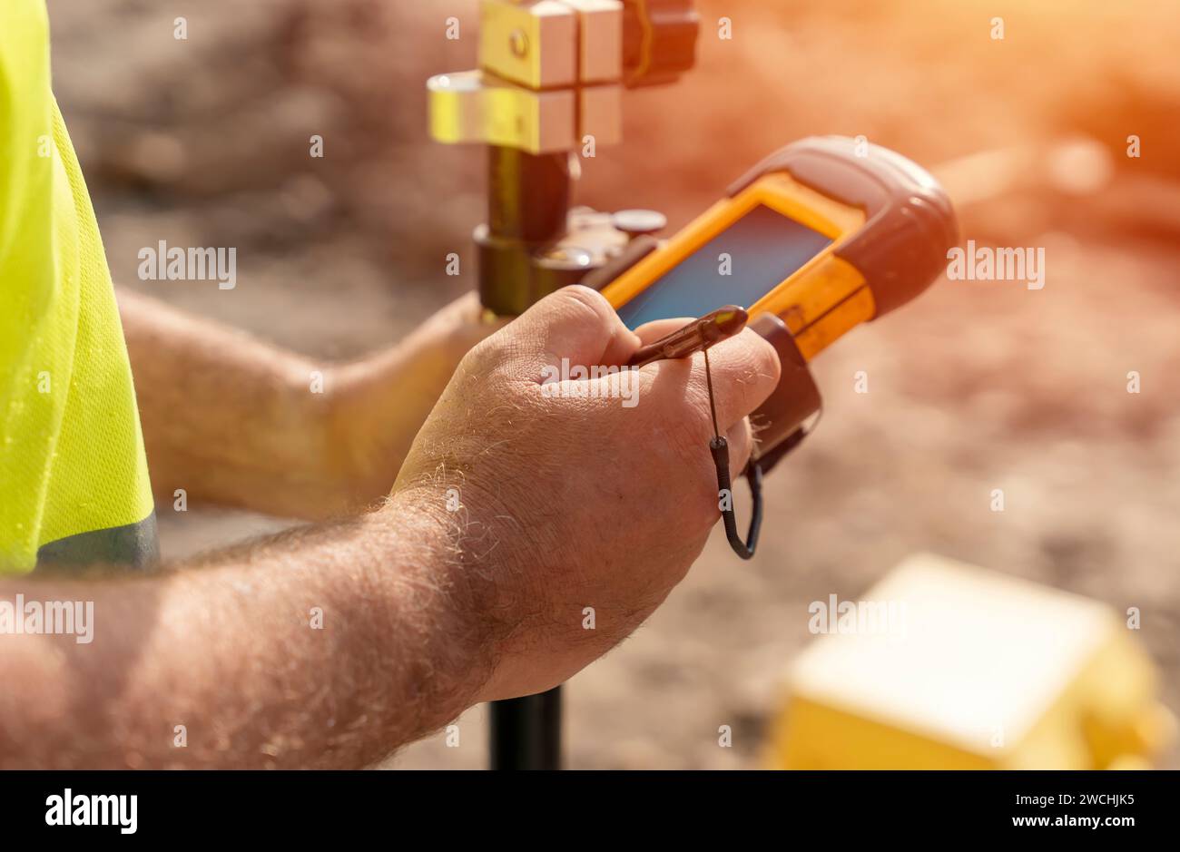 Site engineer surveyor using rugged tablet controller computer to ...