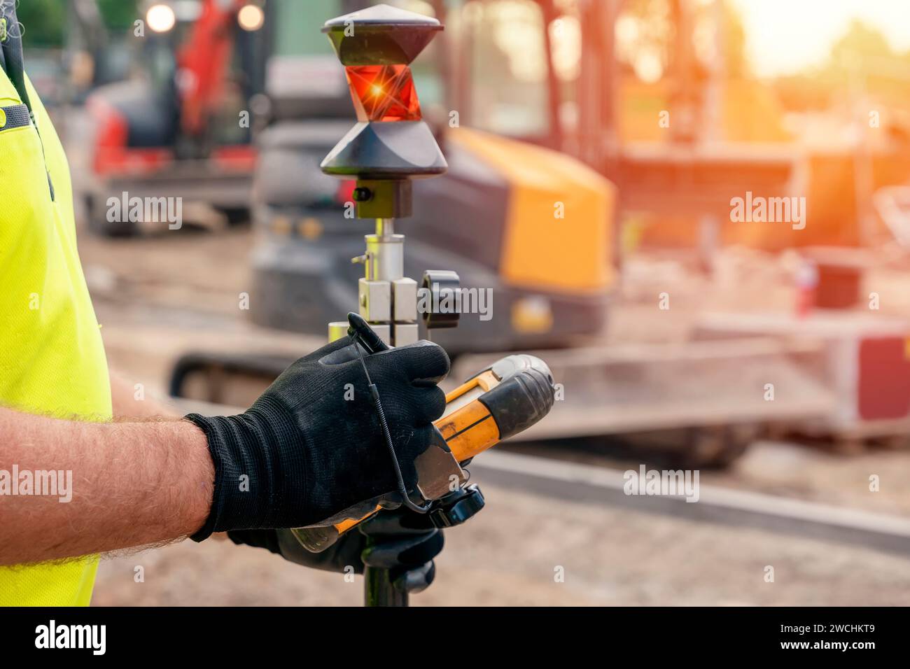 Site engineer surveyor using rugged tablet controller computer to ...