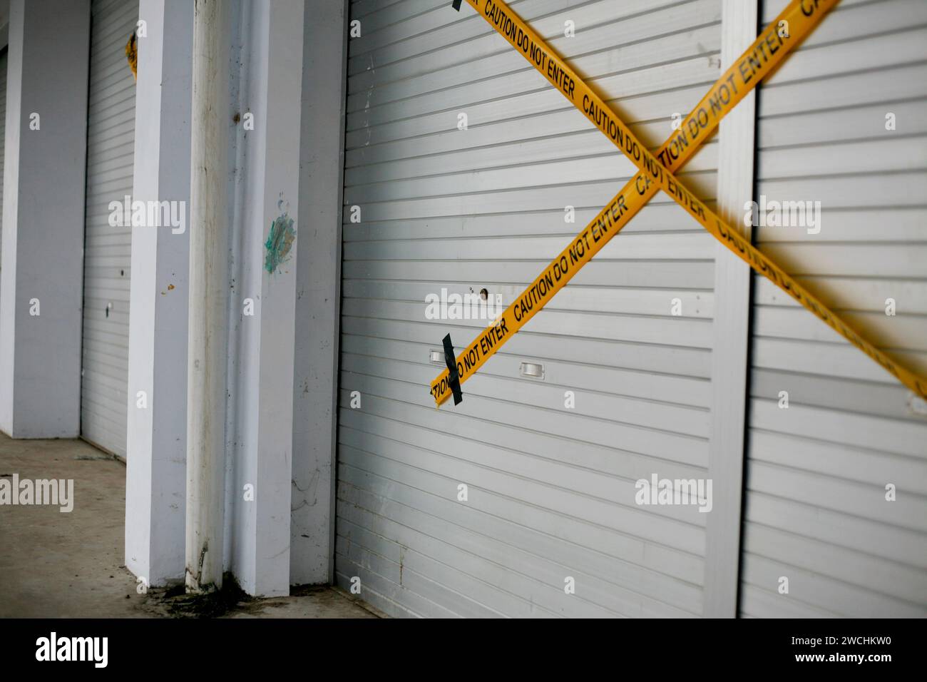 The caution police line do not enter on the metal rolling door Stock ...