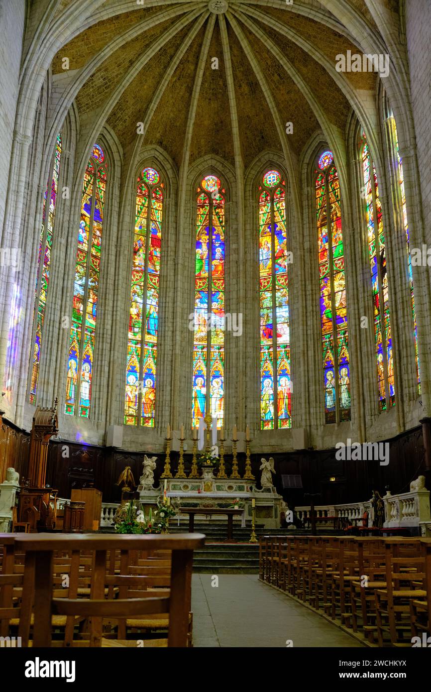 Interior view of a gothic cathedral with striking stained glass windows ...