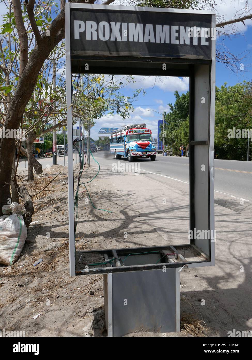 A colourful bus, so called "chicken bus" seem in dilapidated sign ...