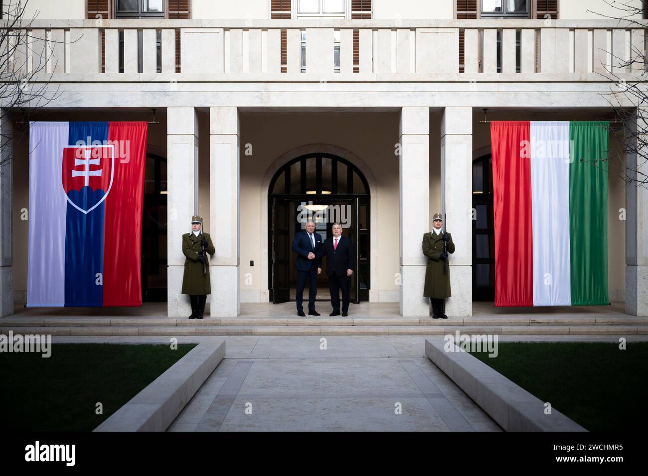 Hungarian Prime Minister Viktor Orban, right, receives Slovakian Prime ...