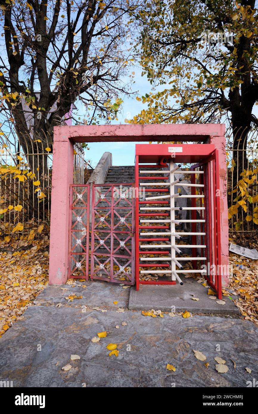 old vintage red stadium turnstile for exit in Albania Stock Photo - Alamy