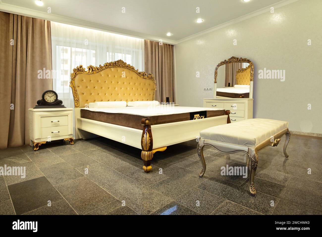 golden furniture details. Big comfortable double royal bed in white ...