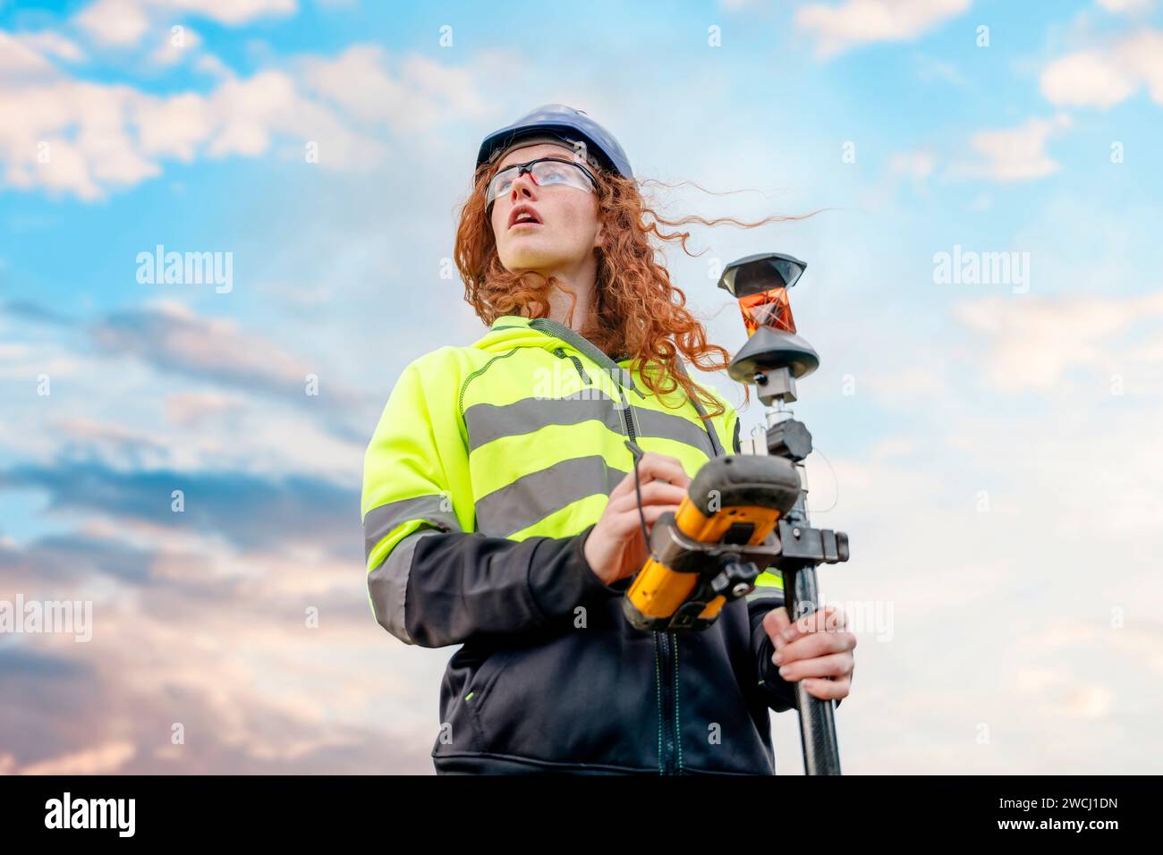 Female Woman land surveyor working with moder surveying geodesic ...