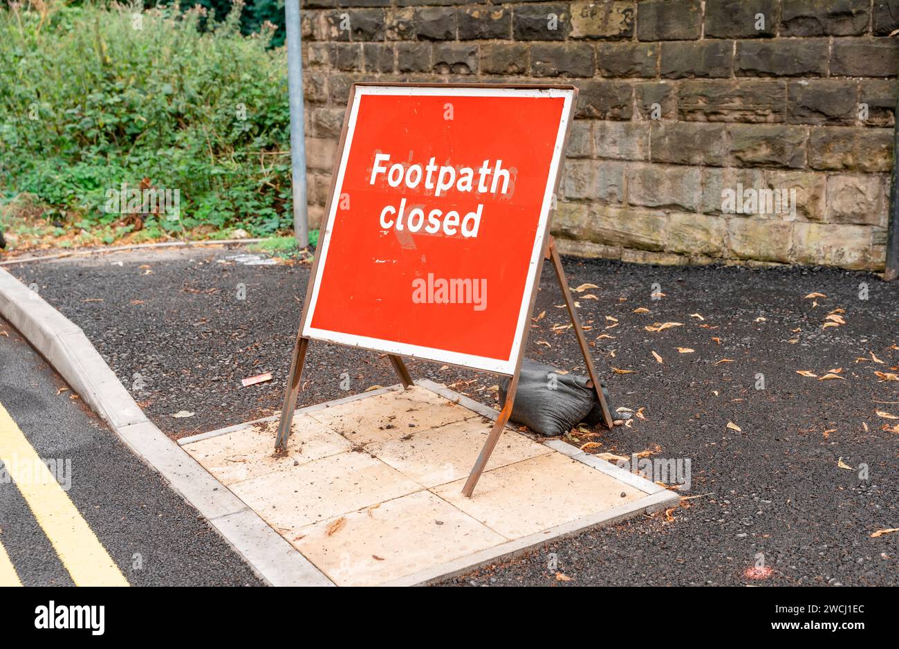 footpath closed sign due to road repairs Stock Photo - Alamy