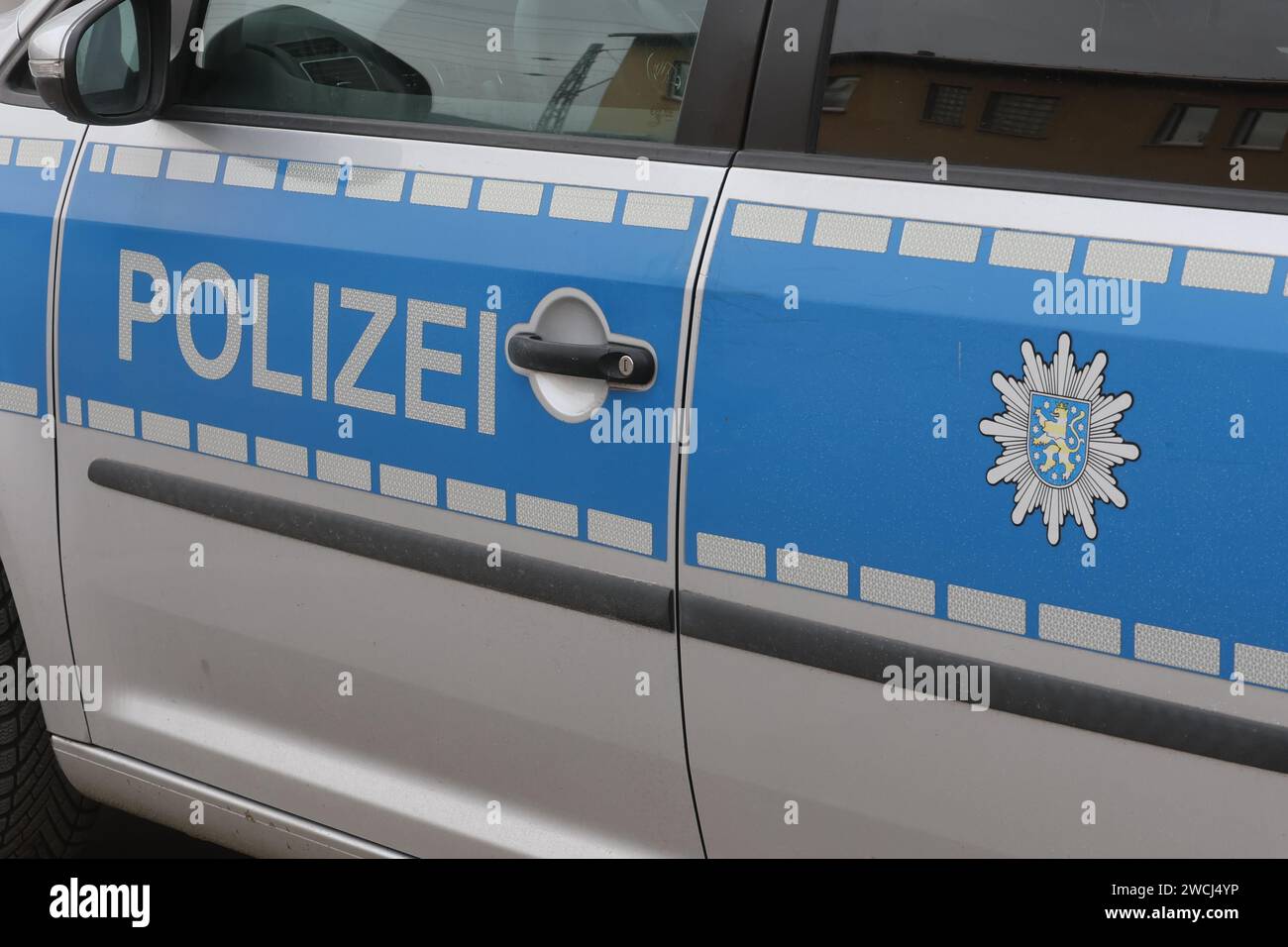Jena, Germany. 16th Jan, 2024. Police" lettering on a Thuringian police ...