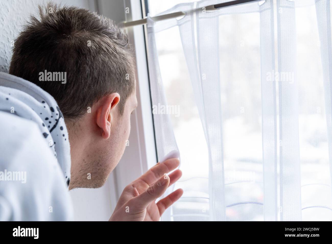 Augsburg, Bavaria, Germany - January 14, 2024: A man looks curiously ...