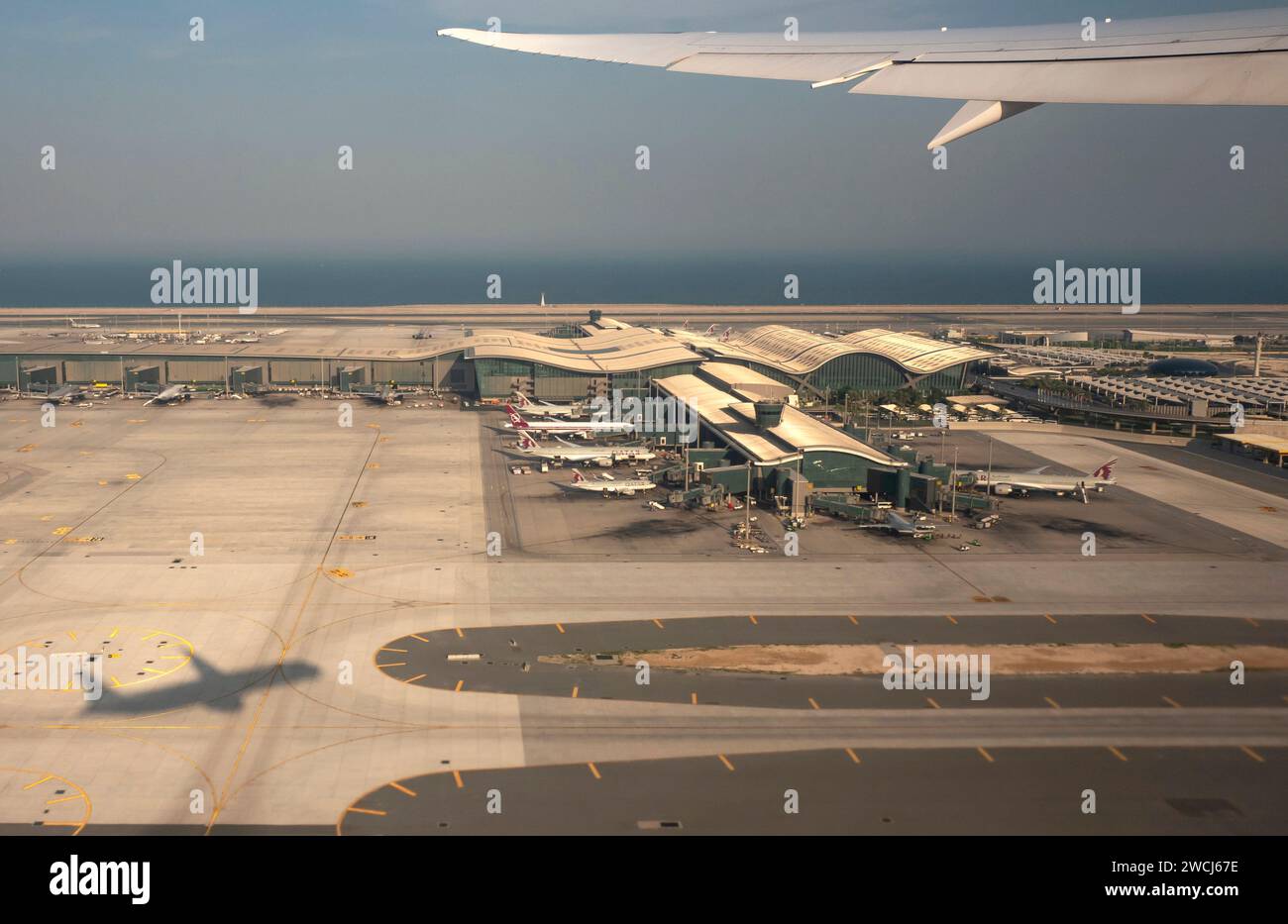 A commercial airplane takes off from Hamad International Airport in ...